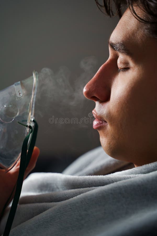 Using Compressor Nebulizer for Disease Treatment at Home. Man Inhaling ...
