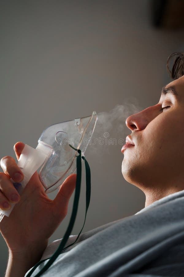 Using Compressor Nebulizer for Disease Treatment at Home. Man Inhaling ...