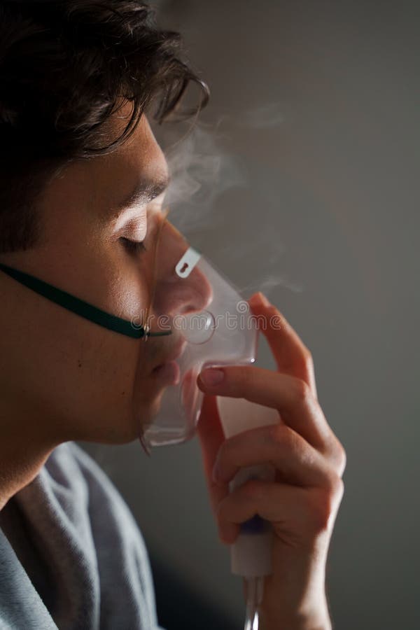 Using Compressor Nebulizer for Disease Treatment at Home. Man Inhaling ...