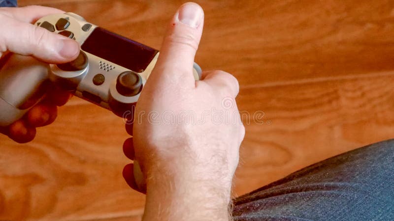 Using a Controller To Play Video Games - a Close-up of Hands and a ...
