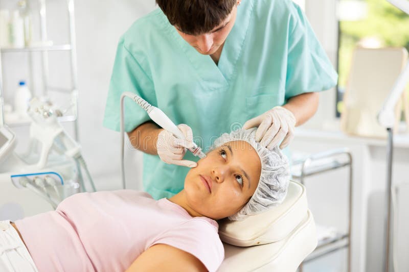 Using Device and Hydrogen Oxygen Cleaning Attachment Stock Photo ...