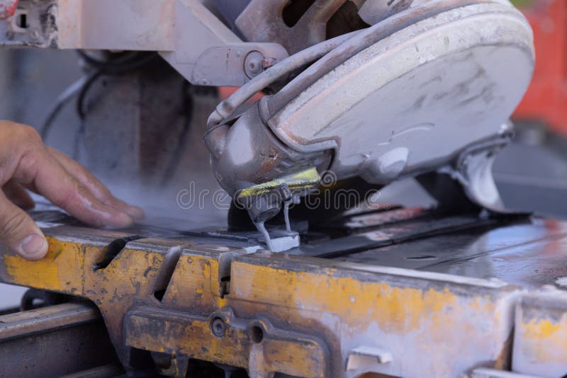 Using Diamond Blade Saw Machine, a Tiler Cuts Ceramic Tiles Stock Photo ...