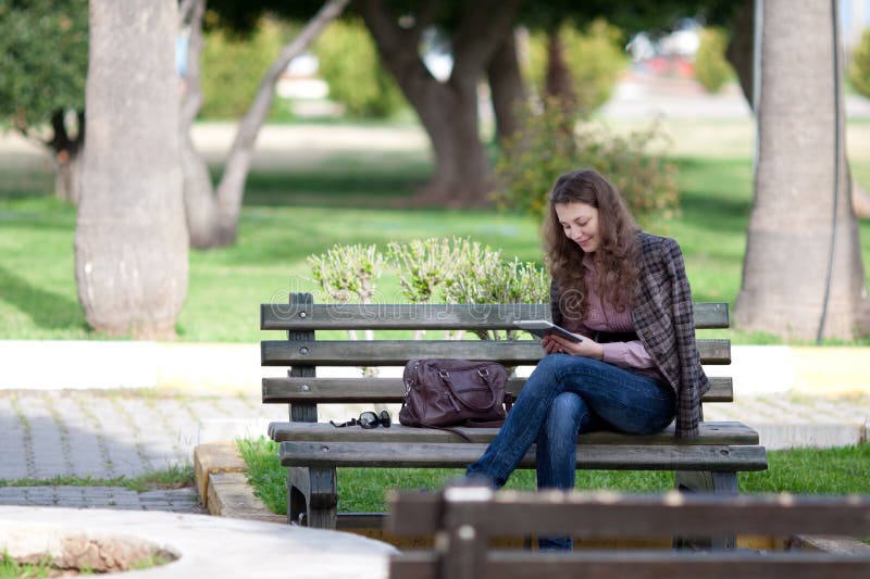 Using digital book stock image. Image of grass, leisure - 24075069