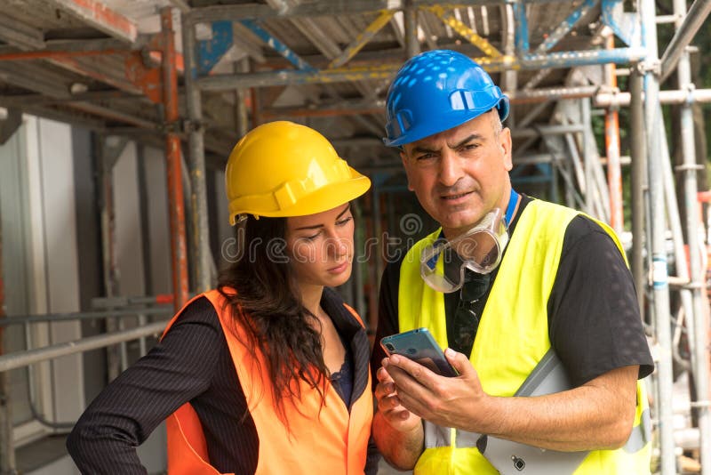 Using Digital Devices on Construction Site Stock Image - Image of ...