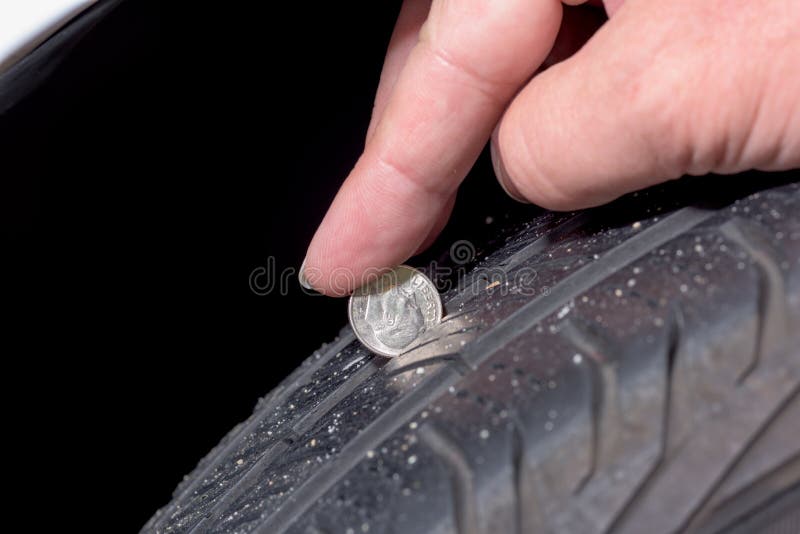 Using a Dime To Check Tire Tred Depth Stock Photo - Image of metal ...