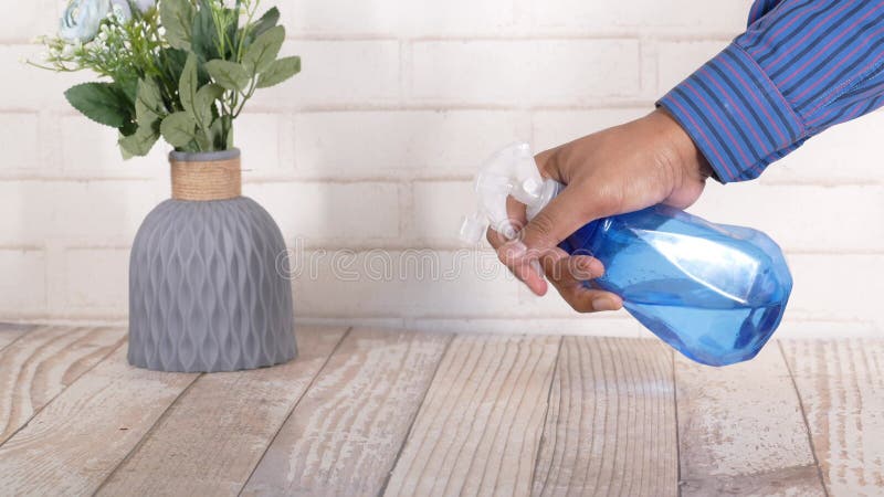 Using Disinfectant Spray To Clean Table Surface Stock Footage - Video ...