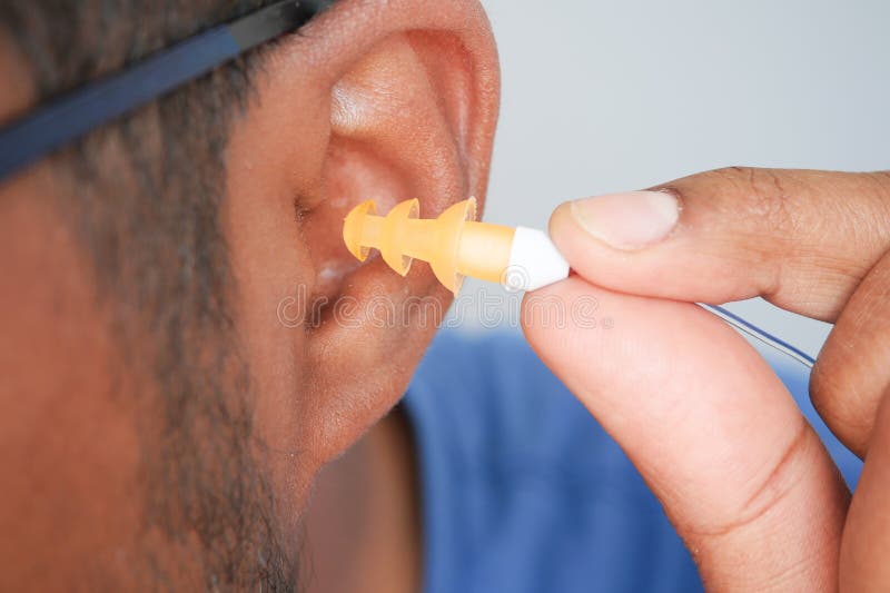 Using Earplugs for Improved Sound Isolation Stock Photo - Image of ...