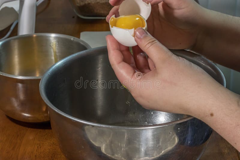 Using an Egg Shell To Separate Stock Photo - Image of bake, chef: 116387648