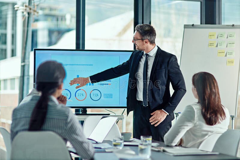 Using Graphs To Enhance the Message Hes Delivering. a Businessman ...