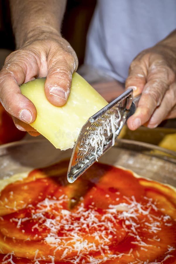 Using a Grater To Grate Cheese Stock Photo - Image of table, dinner ...