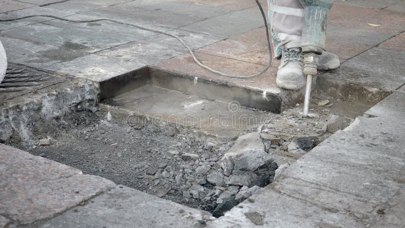 Using a Hammer To Break through Bedrock for Landscaping Event Stock ...