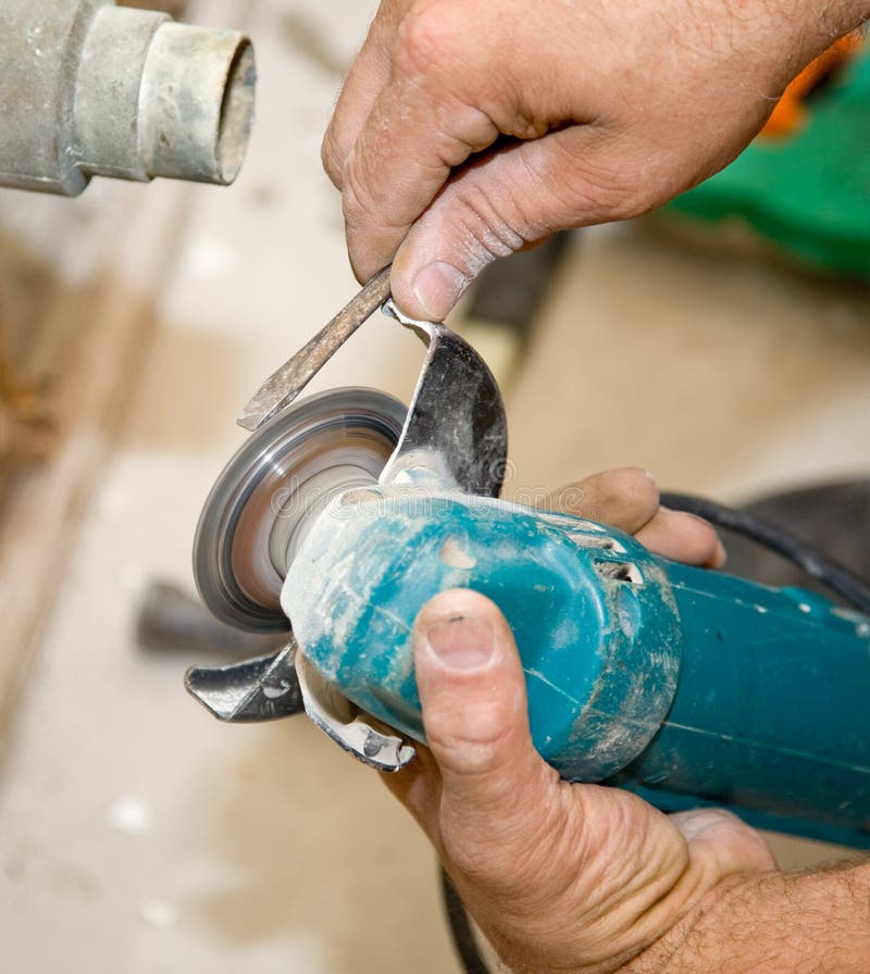 Using Hand Grinder Closeup stock image. Image of installing - 6118879