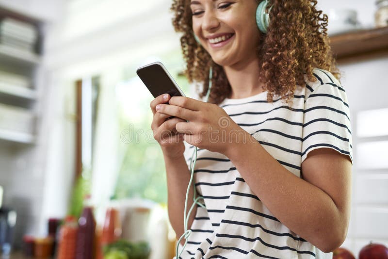 Using Headphones and Mobile Phone Stock Image - Image of activity ...