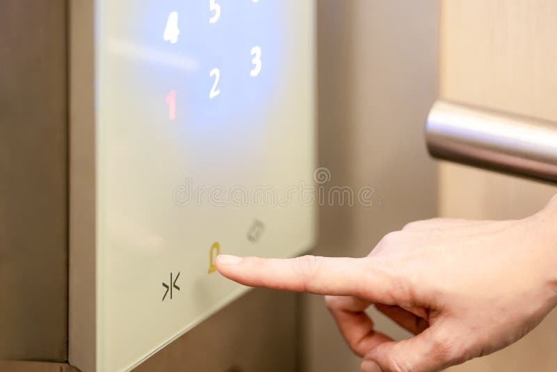 She is Using Her Index Finger To Press the Floor Number that Digital ...