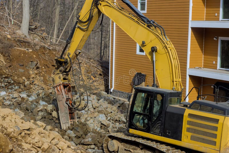 Using a Hydraulic Hammer on the Excavator with a Jackhammer, an ...