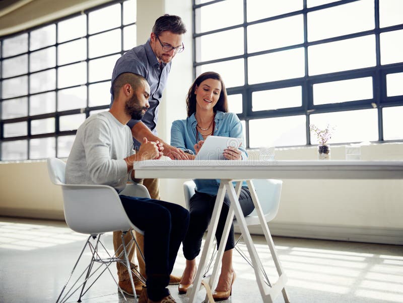 Using the Internet As a Reference. a Group of Designers Using a Digital ...