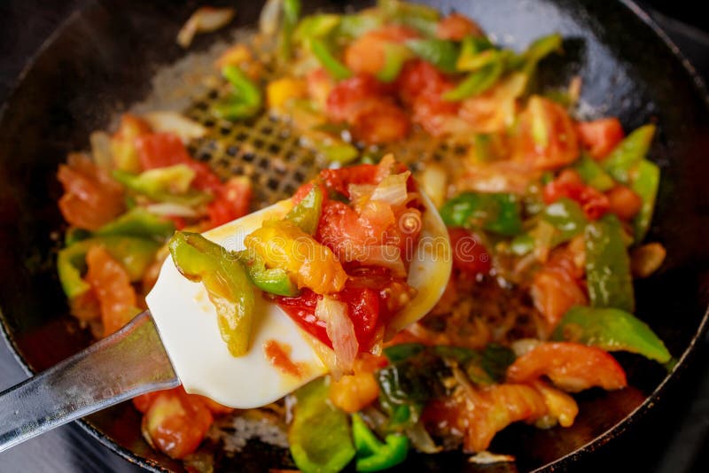 Using Iron Pan Stir-fry Tomatoes and Bell Peppers. Stock Photo - Image ...