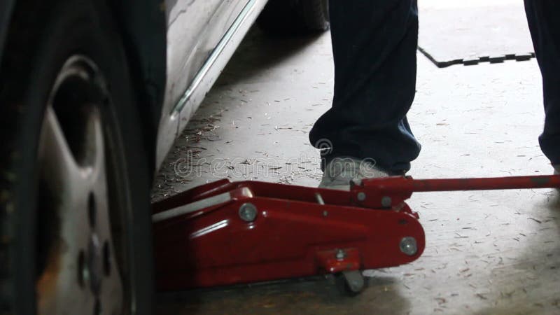 Jacking Up a Car in a Garage 2 Stock Video - Video of mechanical ...