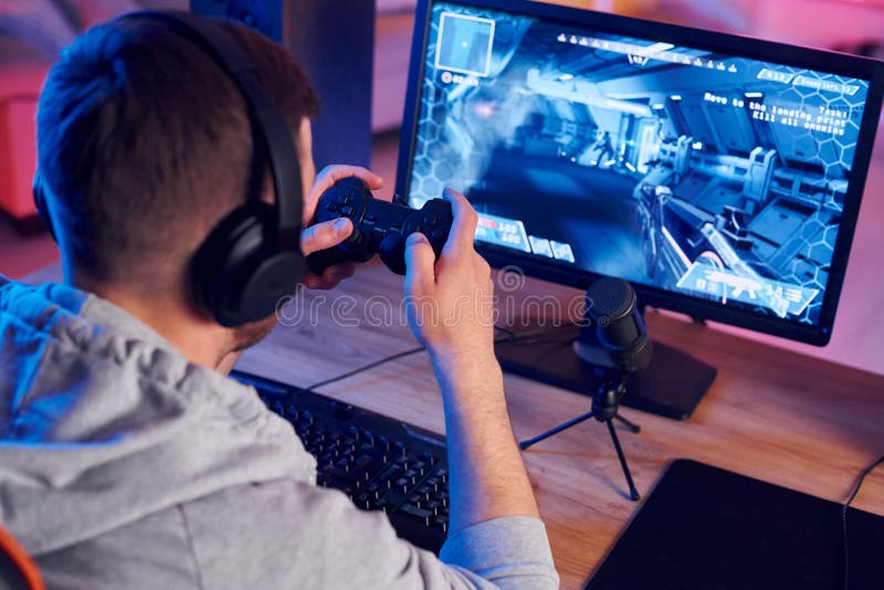 Using the Joystick. Online Streamer Playing FPS Shooter Game at Home ...