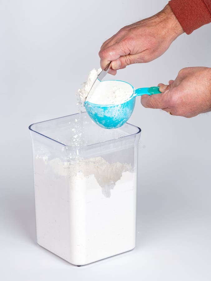 Using a Knife and Measure Cup Flour is Measured Stock Image - Image of ...