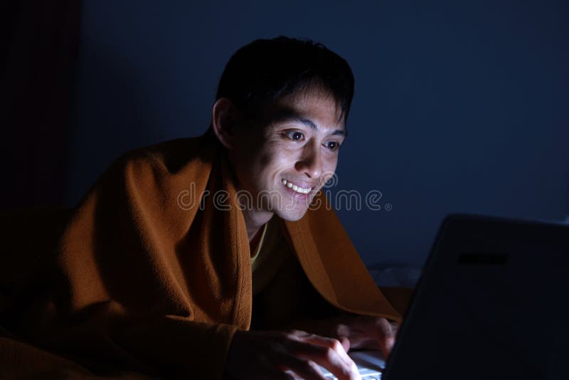 Using Laptop on Bed at Night Stock Image - Image of computer, people ...