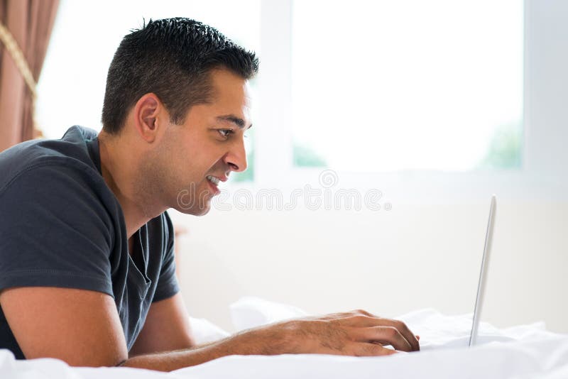 Using laptop in bed stock photo. Image of online, browsing - 52276844
