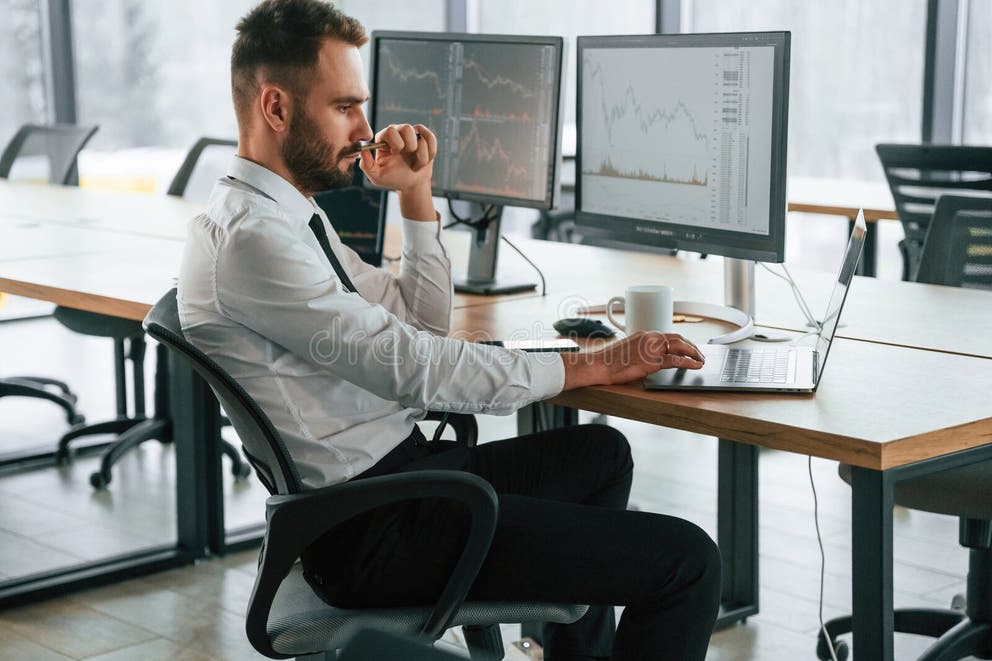 Using Laptop. Businessman is Sitting by Computer and Working in the ...
