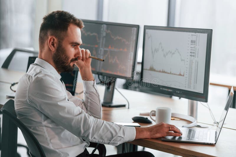 Using Laptop. Businessman is Sitting by Computer and Working in the ...
