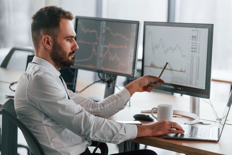 Using Laptop. Businessman is Sitting by Computer and Working in the ...