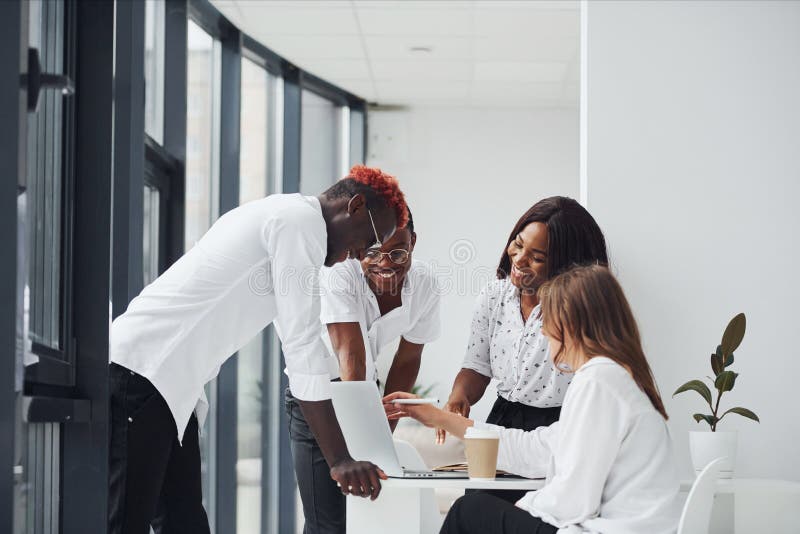 Using Laptop. Group of African American Business People Working in ...
