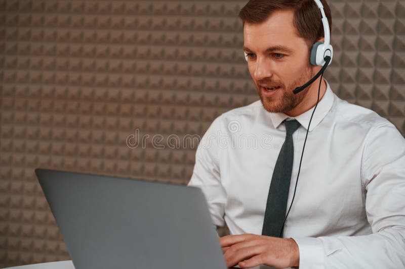 Using Laptop. Handsome Man in Formal Clothes is in the Office Stock ...