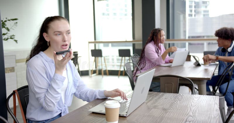 Using Laptop and Recording Voice Message, Woman Working in Modern ...