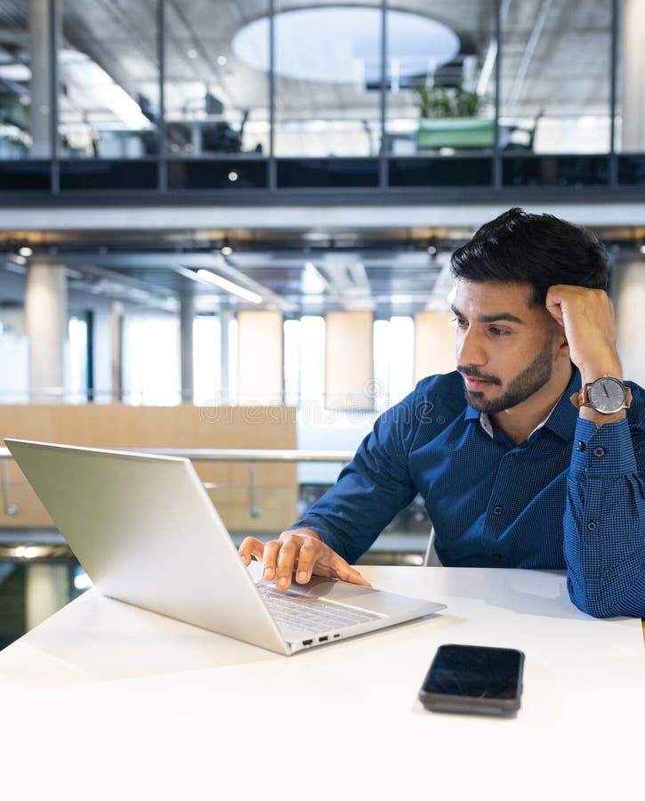 Using Laptop and Smartphone, Businessman Working in Modern Office ...