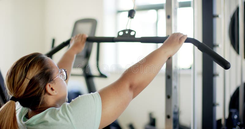 Using Lat Pulldown Machine, Woman with Disability Exercising in Gym for ...