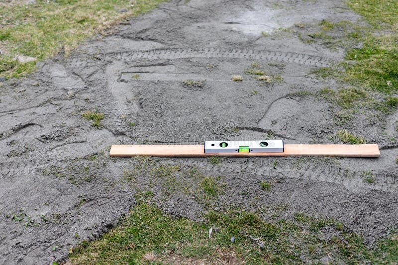 Using Leveler Spirit Level Tool for Moving and Leveling Soil in the ...