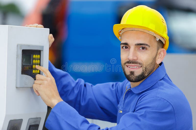 Using Machine and Pressing on Buttons in Factory Stock Photo - Image of ... Using Machine and Pressing on Buttons in Factory Stock Photo - Image of ...