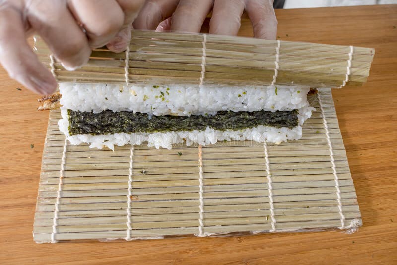 Using a Makisu To Roll a Batch of Tempura Maki Rolls. Making Makizushi ...