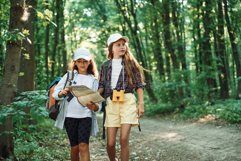 Using the Map. Two Girls is in the Forest Having a Leisure Activity ...