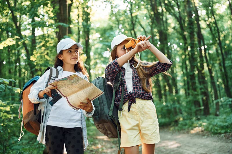 Using the Map. Two Girls is in the Forest Having a Leisure Activity ...