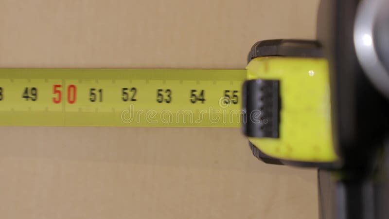 Using measuring tape stock footage. Video of size, clearance - 181438704