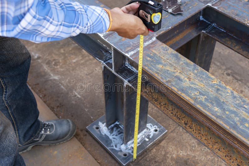 Using a Measuring Tape To Measure the Dimension of Steel Structure Work ...