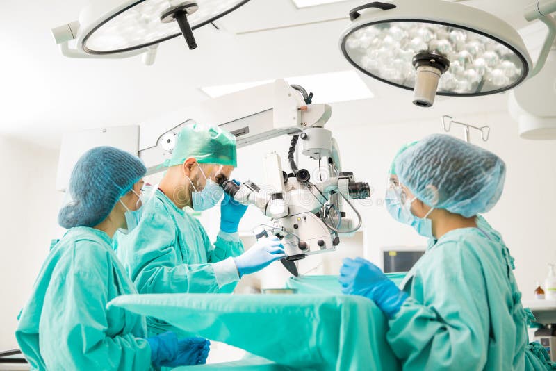 Using a Microscope during Surgery Stock Photo - Image of care, hospital ...