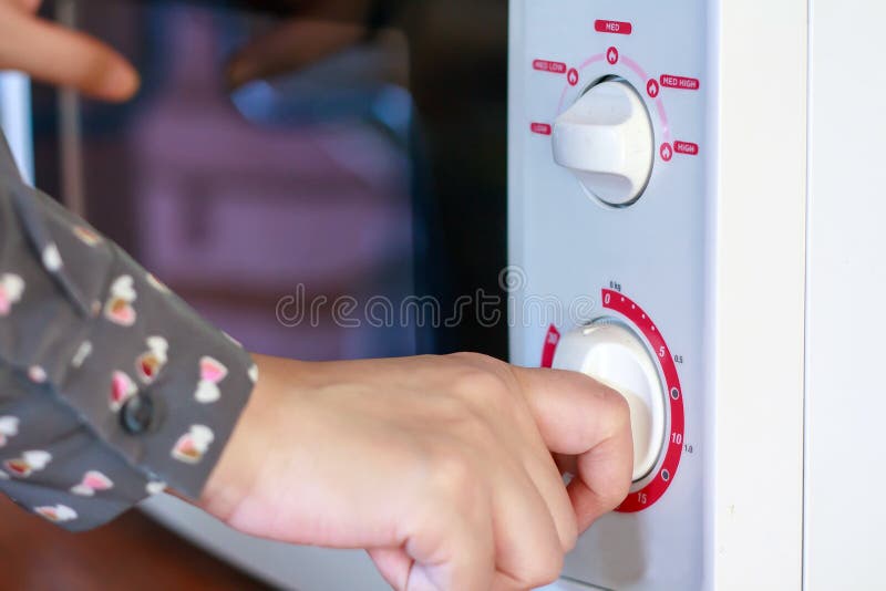 Using microwave oven stock photo. Image of cook, modern - 75036374