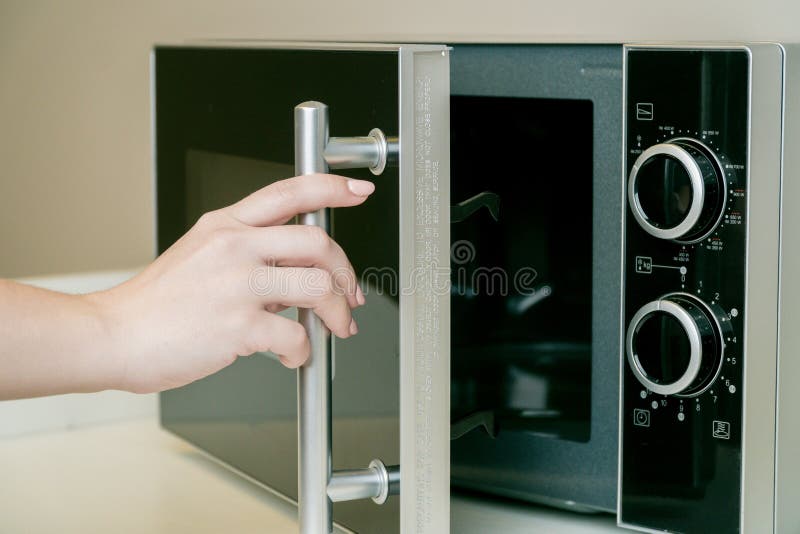 Using Microwave Oven in the Kitchen, Close Up Photo Stock Photo - Image ...