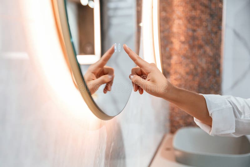 Using the Mirror with Touchscreen Feature. Pretty Young Woman is in the ...