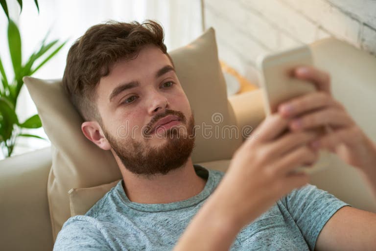 Using mobile app stock image. Image of texting, watching - 99485017