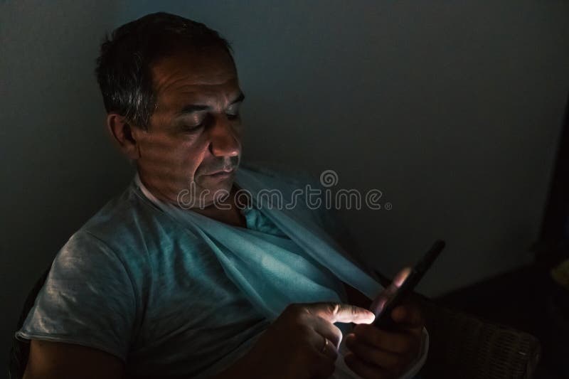 Using Mobile Apps Technology on Cell Phone Late at Night Stock Image ...