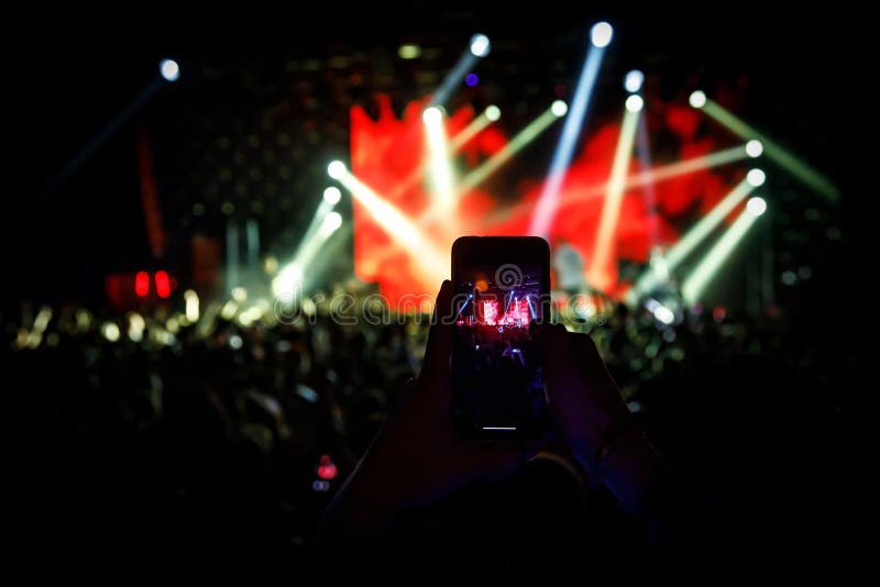 Using a Mobile Phone at the Concert. Stock Photo - Image of business ...
