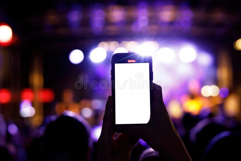 Using a Mobile Phone at a Music Concert. Mock-up with a Blank Screen ...