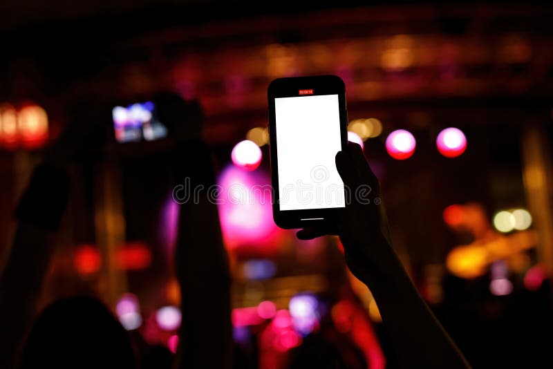 Using a Mobile Phone at a Music Concert. Mock-up with a Blank Screen ...